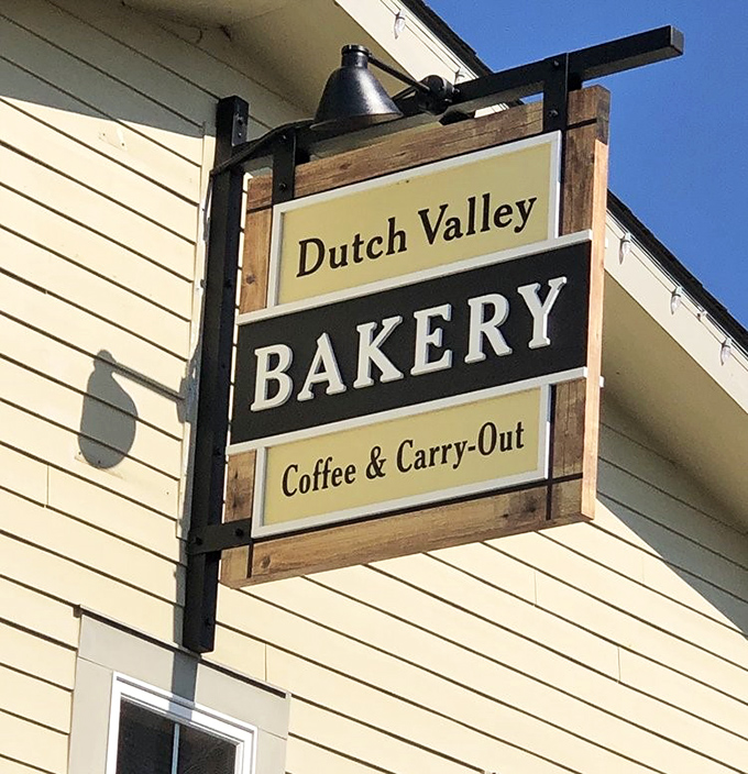 The bakery sign promises coffee and carry-out, which translates to: "Your car will smell amazing all the way home."