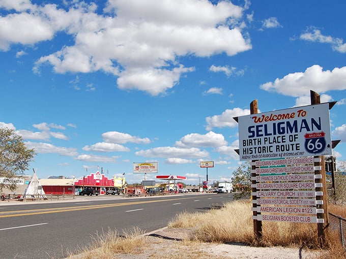 "Welcome to Seligman: Birth Place of Historic Route 66" – where the clouds above seem to pause their journey just to admire the view below.