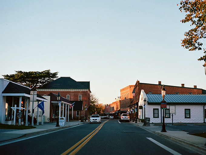 Twilight bathes Berlin's Main Street in golden hour magic, when even the stop signs seem to whisper, "Stay awhile longer, what's your rush?"