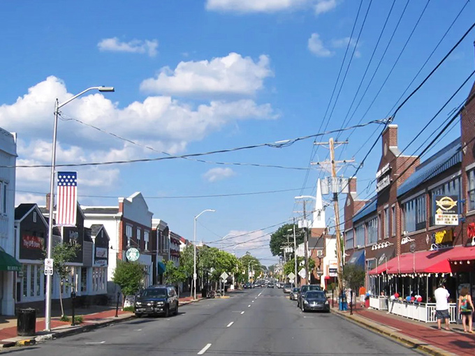 American flags wave proudly along Newark's main corridor, where red brick buildings and blue skies create a patriotic palette.