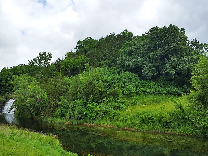 Beyond the falls, the verdant landscape stretches toward the horizon, reminding visitors that Thunder Bay Falls is just one jewel in the Driftless Area's crown.
