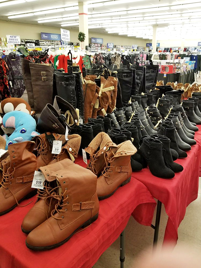 Boot bonanza! Fall footwear displayed with all the drama it deserves. That blue plush elephant is either judging your choices or offering silent support.