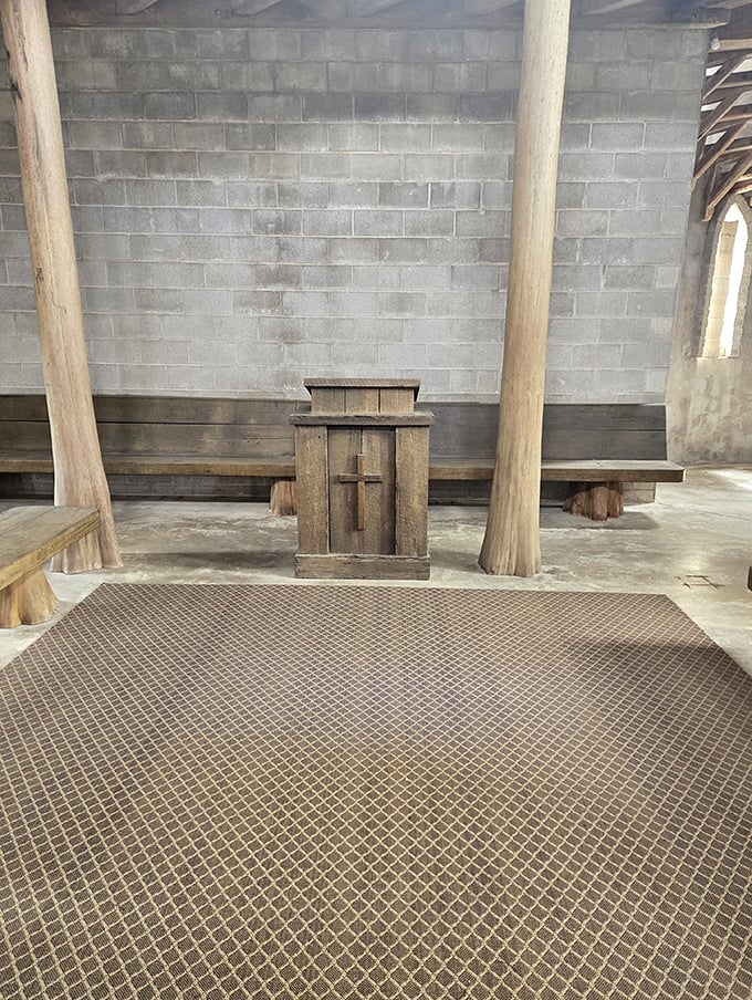 The wooden lectern stands ready for services, its rustic simplicity perfectly matching the castle's blend of spiritual purpose and medieval aesthetics.