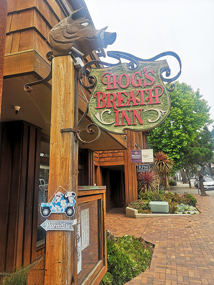 Hog's Breath Inn's whimsical sign featuring a wooden pig &ndash; Carmel's storybook charm meets serious steak business.