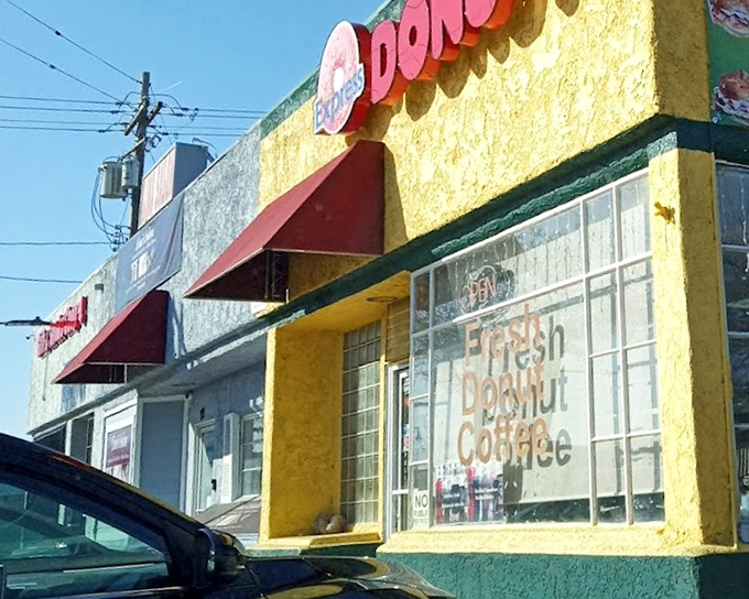 Bold colors outside, bold flavors inside. This cheery yellow shop houses serious donut business.