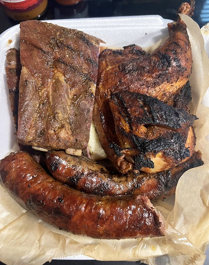 The carnivore's dream plate. Ribs, brisket, and sausage—it's like the meat equivalent of hitting the lottery three times in one day.