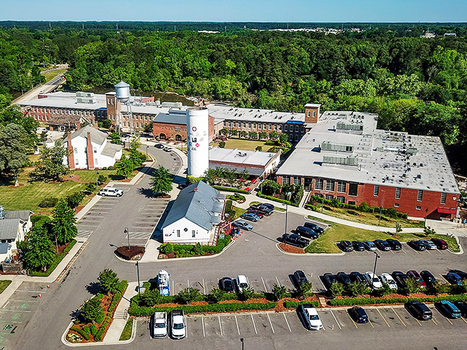 An aerial view reveals Rocky Mount Mills' transformation into a mixed-use development, where old brick buildings find new purpose in the 21st century.