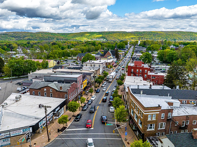 From above, Hackettstown reveals itself as a perfect blend of small-town charm and natural beauty. The surrounding hills embrace the town like a green and gold hug.