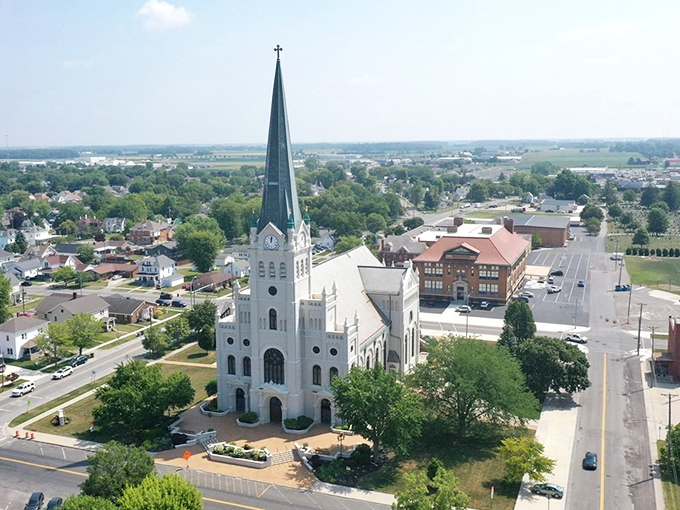 From above, St. John's impressive silhouette anchors Delphos like a spiritual compass rose, surrounded by the quilt-like pattern of neighborhoods and farmland.