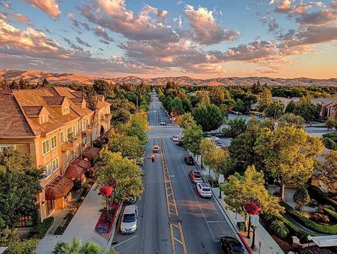 This sunset aerial view reveals Vacaville's perfect positioning&mdash;nestled between rolling hills with breathing room that coastal cities only dream about.