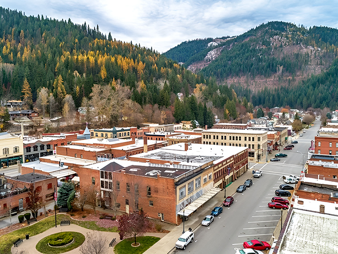 From above, Wallace reveals itself as a perfect grid of red-brick buildings nestled in a mountain valley, autumn colors painting the surrounding hillsides gold.