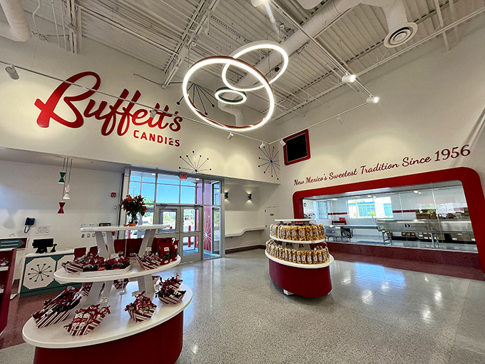 "New Mexico's Sweetest Tradition Since 1956" proclaims the wall, while circular lighting fixtures hover like sugar-powered UFOs above tempting displays.
