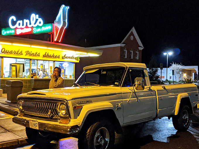 Carl's after dark, glowing like a beacon for dessert pilgrims. Even that vintage truck seems to understand it's participating in an American ritual.