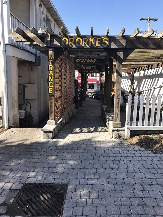 The back entrance promises seafood and cold beer&mdash;two magic words that have lured countless hungry souls through this archway.