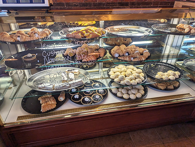 The display case of dreams. Croissants, cookies, and pastries arranged like edible art, each one promising a moment of pure bliss with every buttery, flaky bite. 