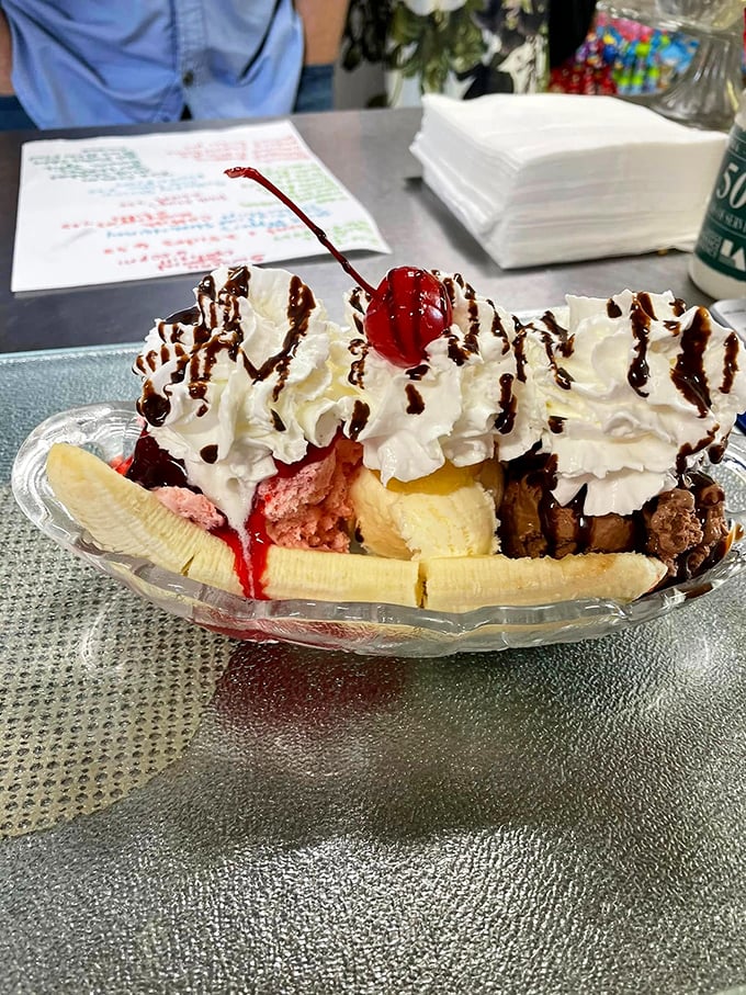 This banana split isn't just dessert&mdash;it's a celebration with whipped cream fireworks, chocolate drizzle confetti, and a cherry on top for good measure.