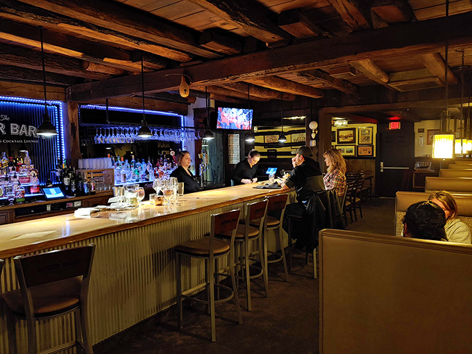 The bar where Old Fashioneds are poured with precision and strangers become friends over tales of the best steaks they've ever had.