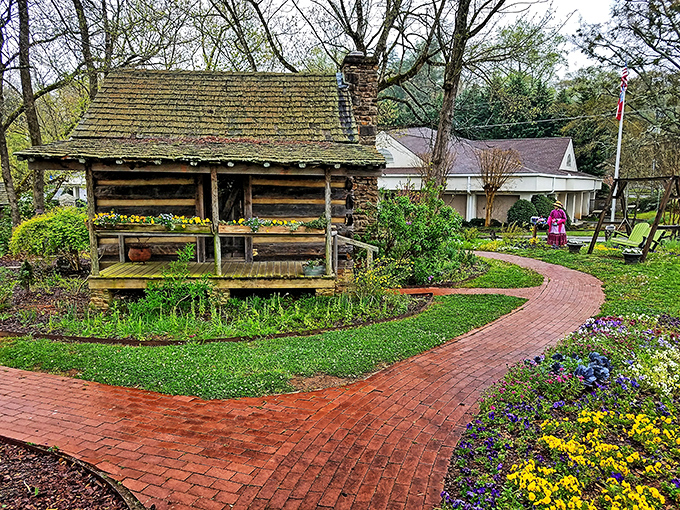 This historic log cabin surrounded by blooming gardens is what appears in your mind when someone says "mountain getaway" or "screen saver."