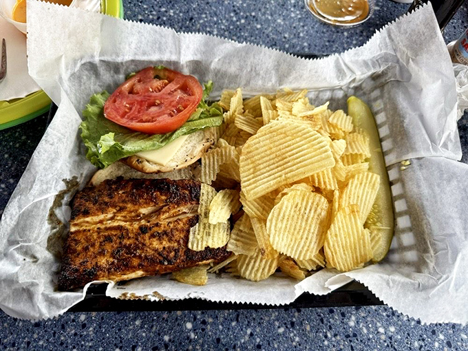 A blackened fish sandwich that makes you wonder why you'd ever order anything else. Those rippled chips are just showing off.