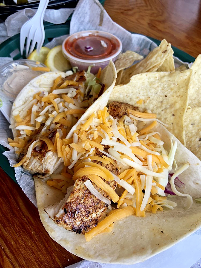 Blackened mahi tacos with cheese pulling double duty as both ingredient and edible sunshine. Simple food made extraordinary by location and freshness.
