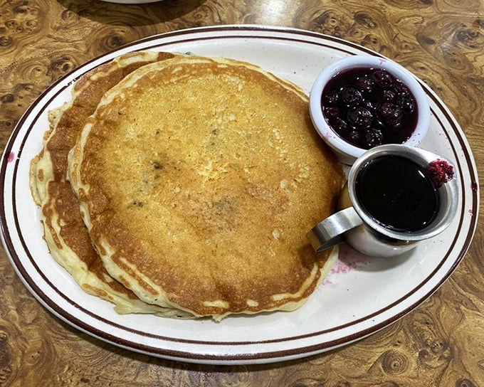 Blueberry pancakes with the supporting cast of syrup and compote. The holy trinity of breakfast satisfaction awaits on this perfectly simple plate.