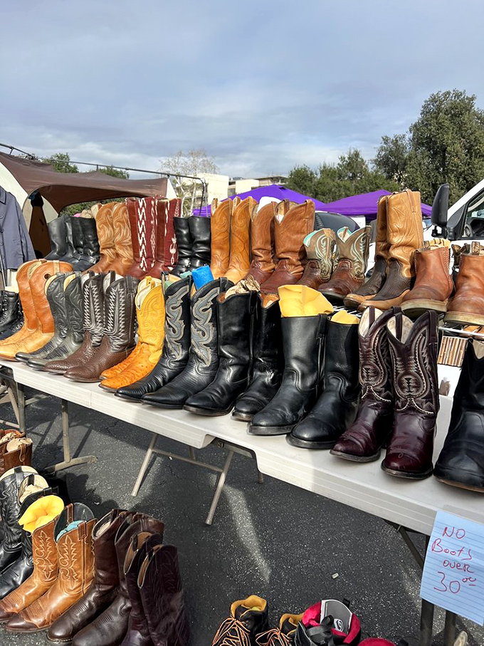Boot boulevard! Each pair tells a story of dusty trails, dance floors, or motorcycle rides. The sign says none over 30&deg;, but these beauties have seen much hotter days.