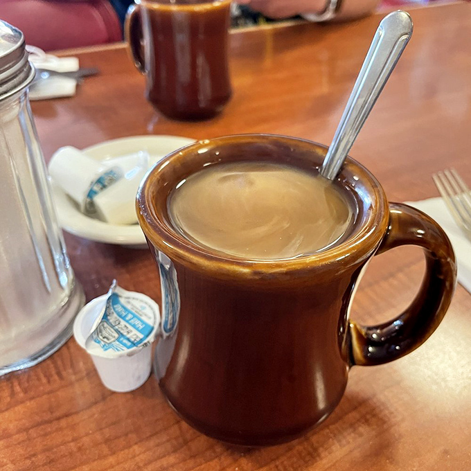 The humble brown coffee mug&mdash;keeper of secrets, starter of days, and proof that sometimes the simplest pleasures are the most reliable.