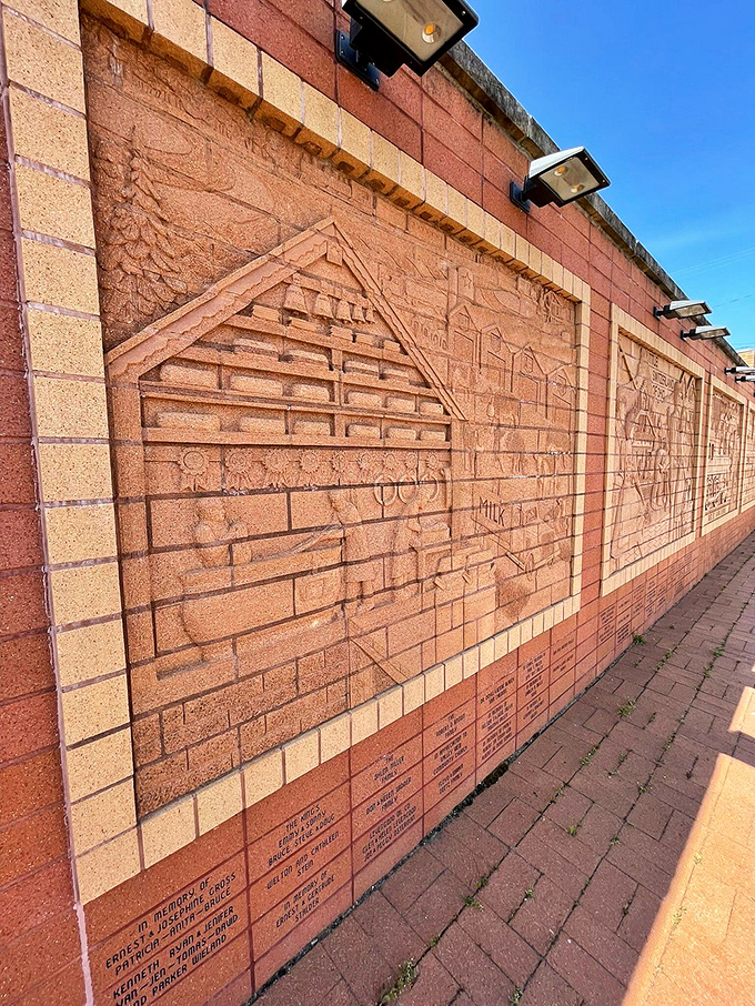 This brick wall sculpture tells Sugarcreek's story in stone&mdash;proof that before PowerPoint presentations, communities found more lasting ways to share their history.