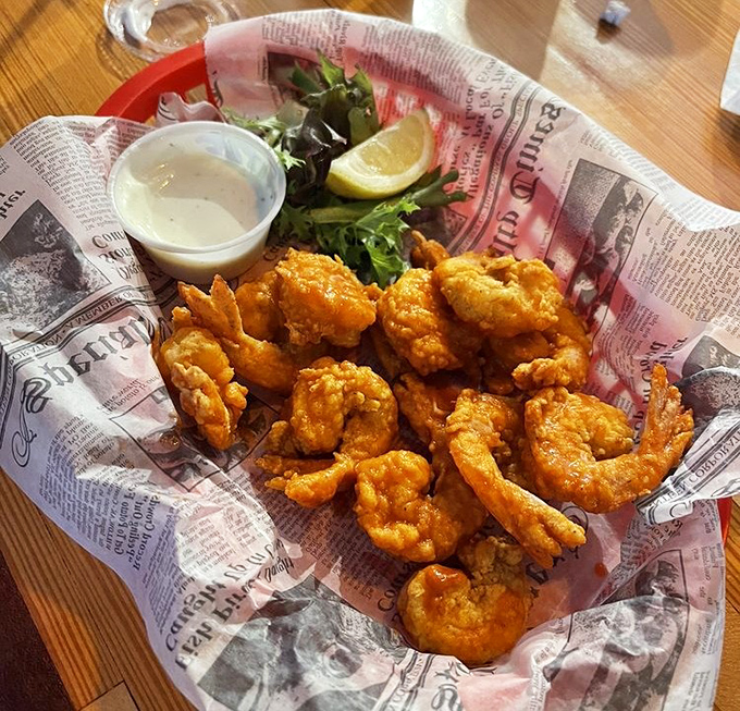 Buffalo fried shrimp served on newspaper &ndash; because when seafood is this good, even the New York Times would be honored to be used as wrapping.