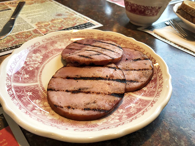 Grilled Canadian bacon that's traveled south to find its destiny on your breakfast plate&mdash;thick-cut, perfectly charred, and ready for its close-up.
