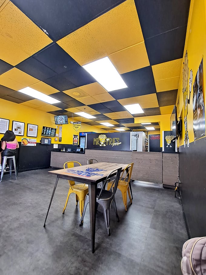 The checkerboard ceiling adds to the playful vibe, as if to say, "Yes, we take fries seriously, but we're having fun doing it."