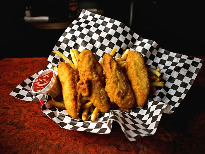 Golden-battered chicken tenders nestled beside crispy fries&mdash;comfort food that speaks the universal language of "everything's going to be okay."