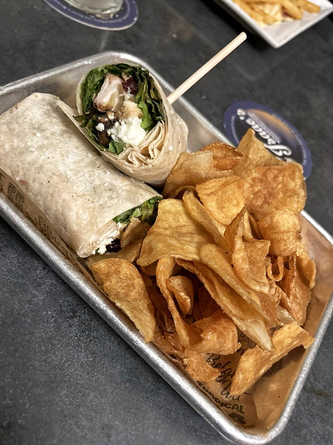 This chicken and goat cheese wrap with house-made chips proves that lunch doesn't have to be boring to be portable. Flavor mobility at its finest.