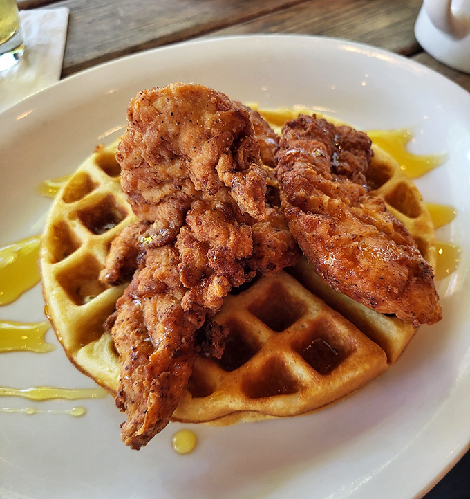 The ultimate breakfast power couple—crispy fried chicken atop a golden waffle. Like Batman and Robin, if they were delicious and served with maple syrup.