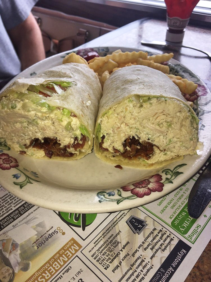 That chicken salad wrap looks so fresh and generous, it's practically begging to become your new lunch obsession.