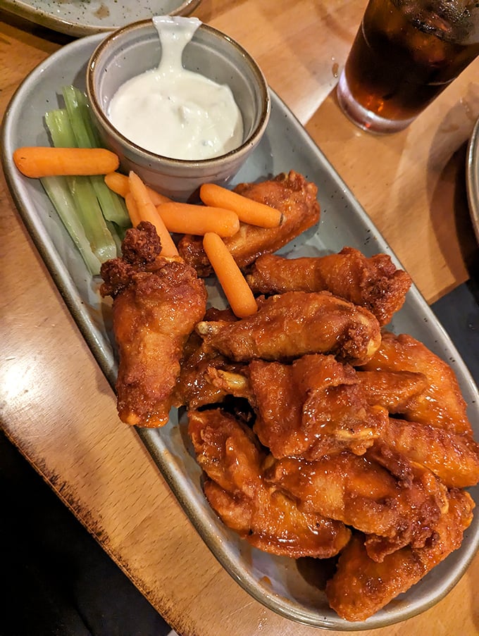 Wings that have clearly earned their sauce badges, served with the traditional cooling agents of ranch and vegetables.