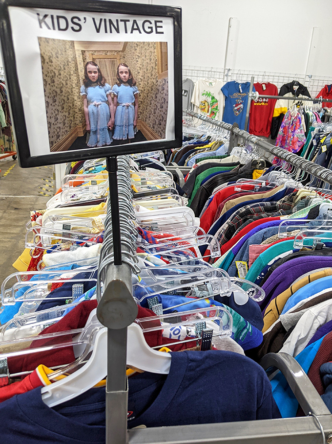 The children's section, complete with a horror movie reference that's either brilliantly ironic or slightly concerning for a kids' clothing department.
