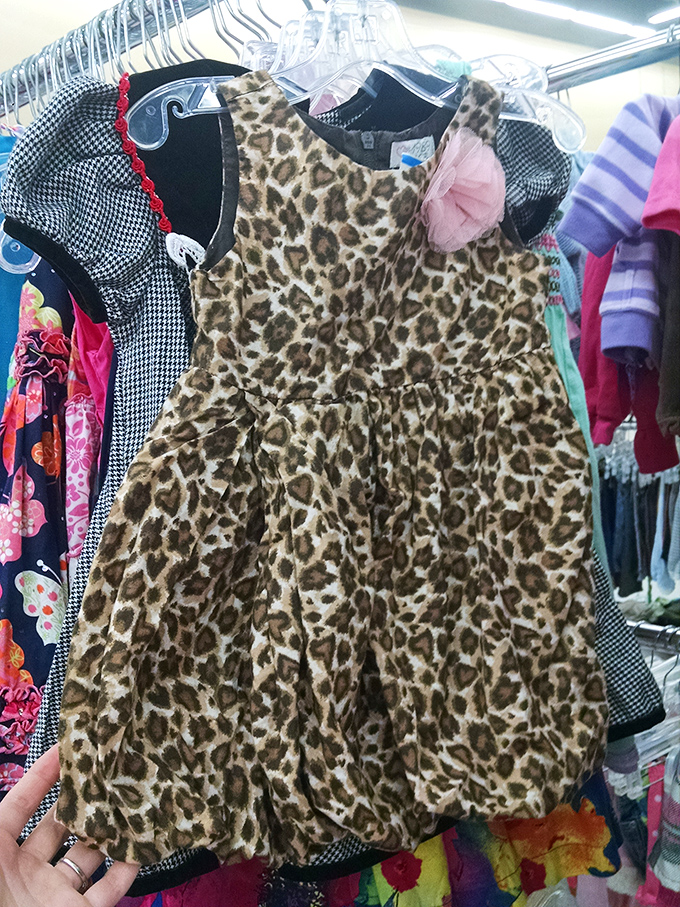One shopper's outgrown leopard print dress becomes another child's dress-up treasure &ndash; the circle of thrift continues.