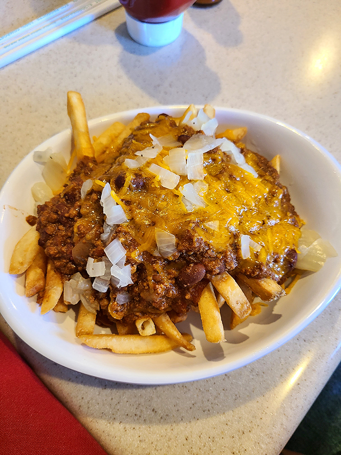Chili cheese fries that don't apologize for being exactly what they are: a glorious, melty mountain of comfort that makes nutritionists weep and taste buds rejoice.