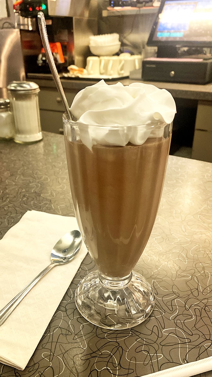 A chocolate milkshake topped with a cloud of whipped cream &ndash; the kind that makes you wish straws were wider and afternoons were longer.