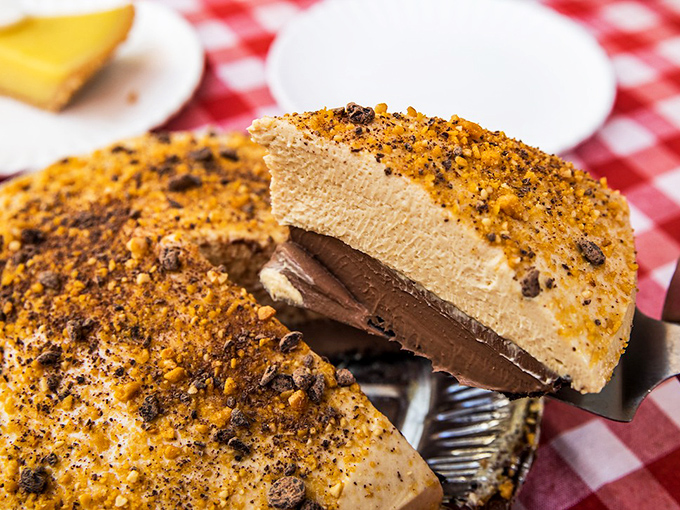 Chocolate peanut butter pie with that perfect cross-section reveal. Like seeing the geological layers of dessert paradise.