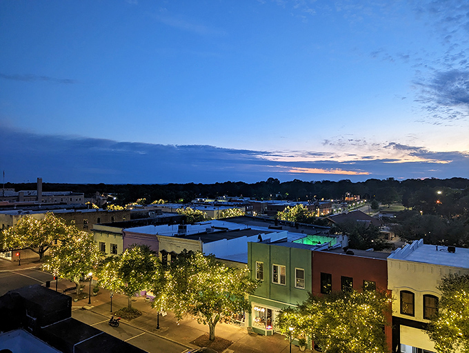 As twilight falls, Shelby's downtown lights twinkle like stars brought down to earth, proving small-town evenings can outshine big-city nights.