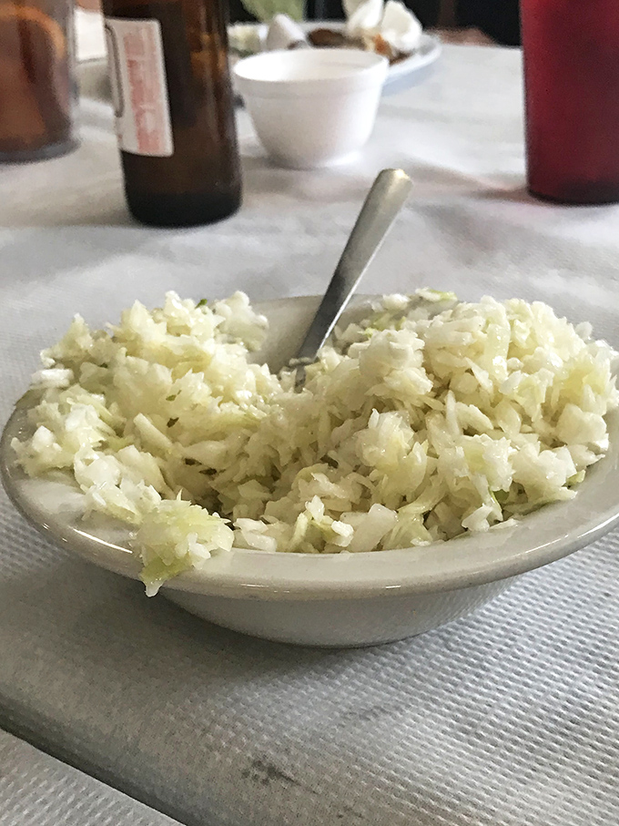 Simple, tangy coleslaw that knows its role: to cut through richness and refresh your palate for the next bite of fried goodness.