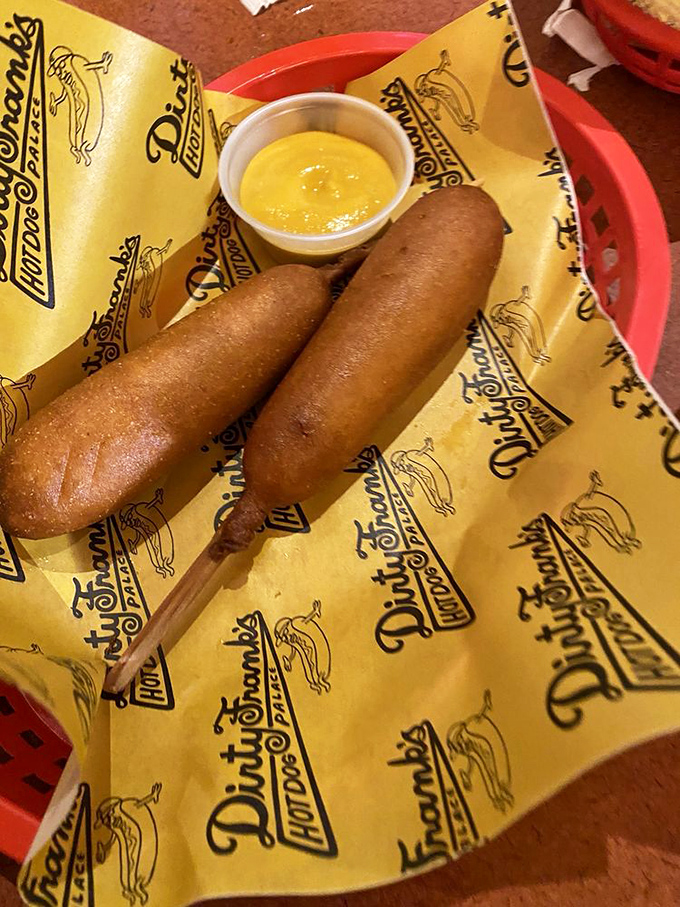 Corn dogs standing at attention, ready for their mustard bath &ndash; simple, nostalgic, and proof that some classics need no improvement.