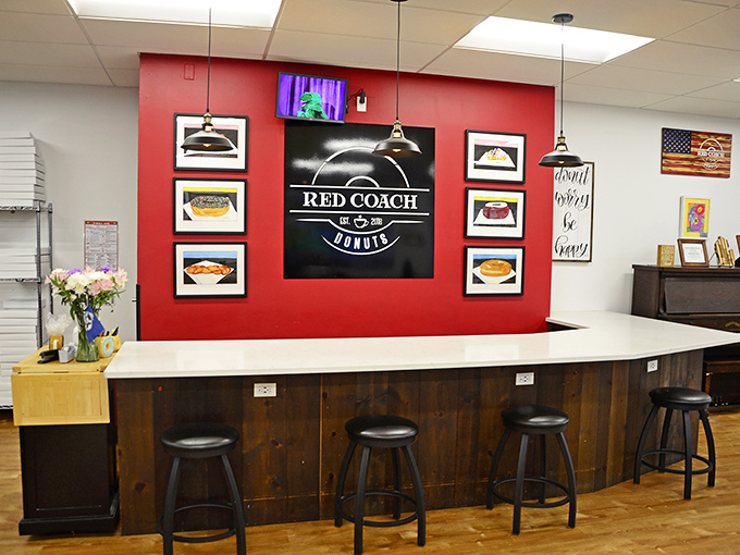 The red accent wall perfectly frames the Red Coach logo &ndash; a splash of color as bold as the flavors in their signature treats.