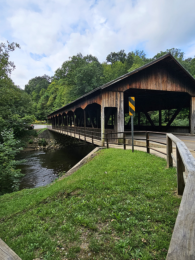 This covered bridge isn't just functional&mdash;it's a portal to simpler times. Its weathered wooden beams have witnessed decades of travelers seeking connection with nature.