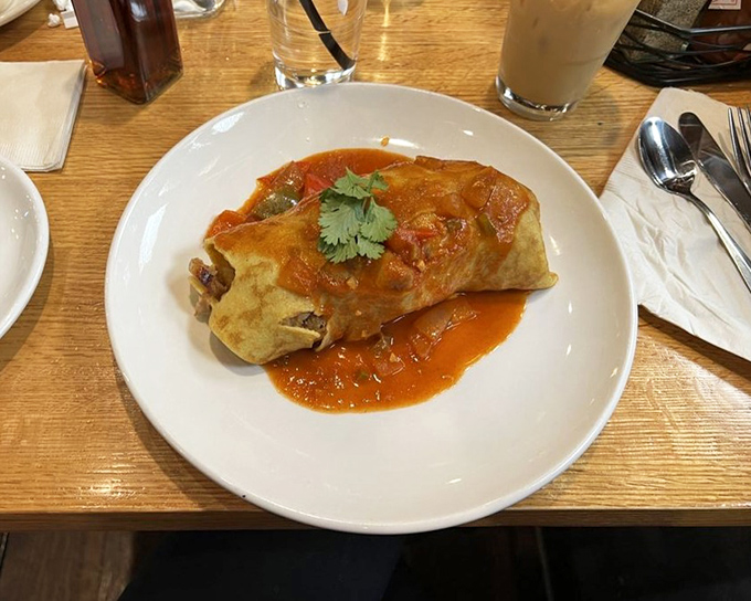 This isn't your standard breakfast burrito&mdash;it's a morning masterpiece wrapped in a tortilla, with sauce that demands to be savored.