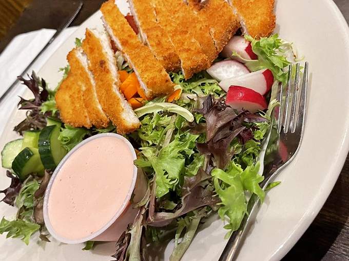 A crispy chicken salad that proves Germans understand more than just meat and potatoes &ndash; those golden cutlet pieces practically demand a fork salute!