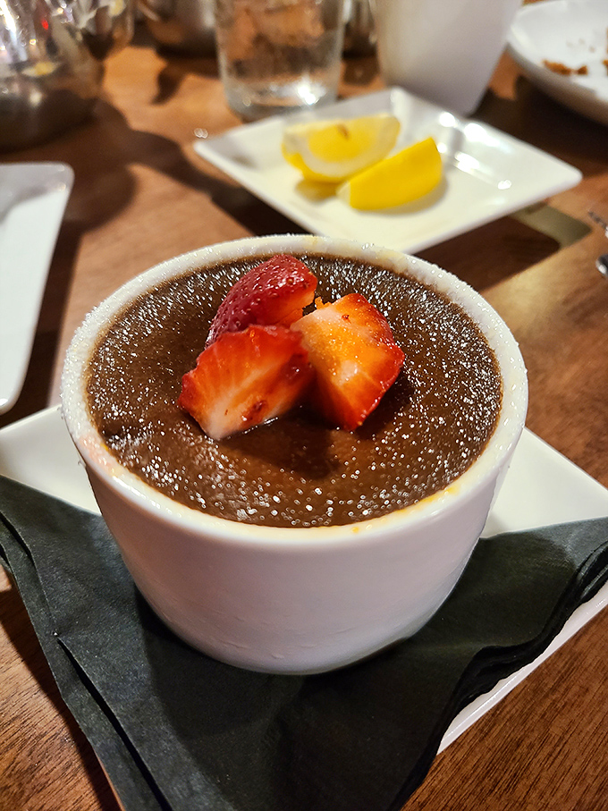 Dessert that demands a moment of silence &ndash; a silky custard topped with fresh berries that's worth saving room for, no matter how good the steak was.