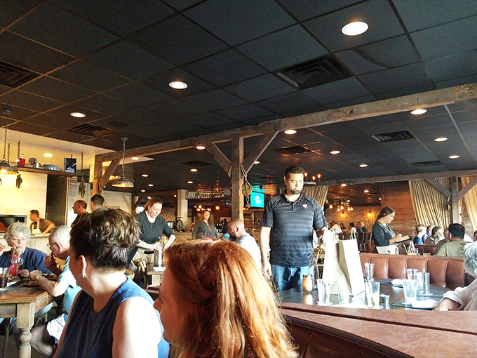 A dining room filled with people who look like they've just discovered the answer to life's most delicious question.